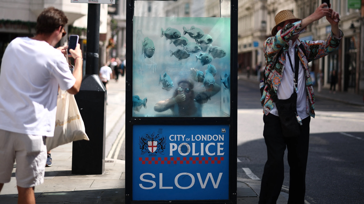 The police sentry box that Banksy emblazoned with piranhas during his ...